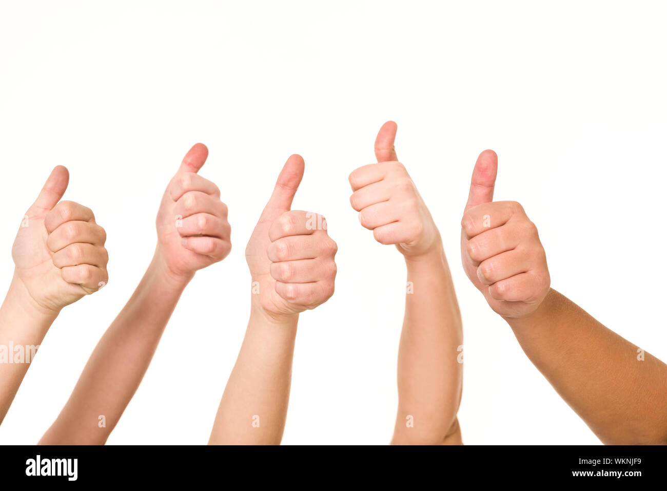 Five hands doing thumbs up isolated on white background Stock Photo - Alamy