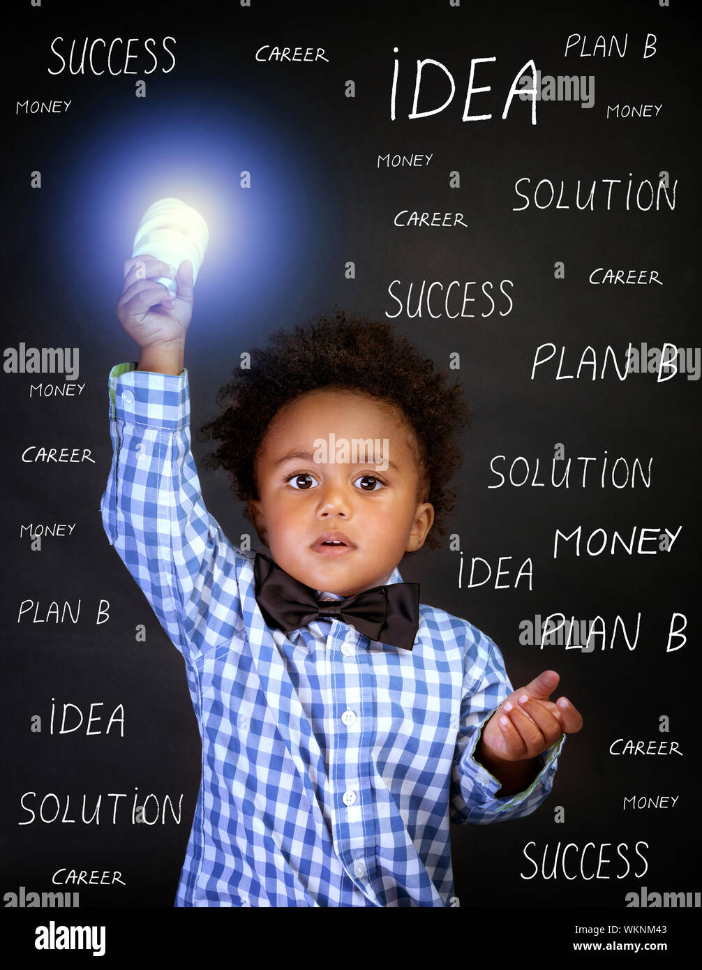 Portrait of little African genius boy with lightbulb in the hand on ...