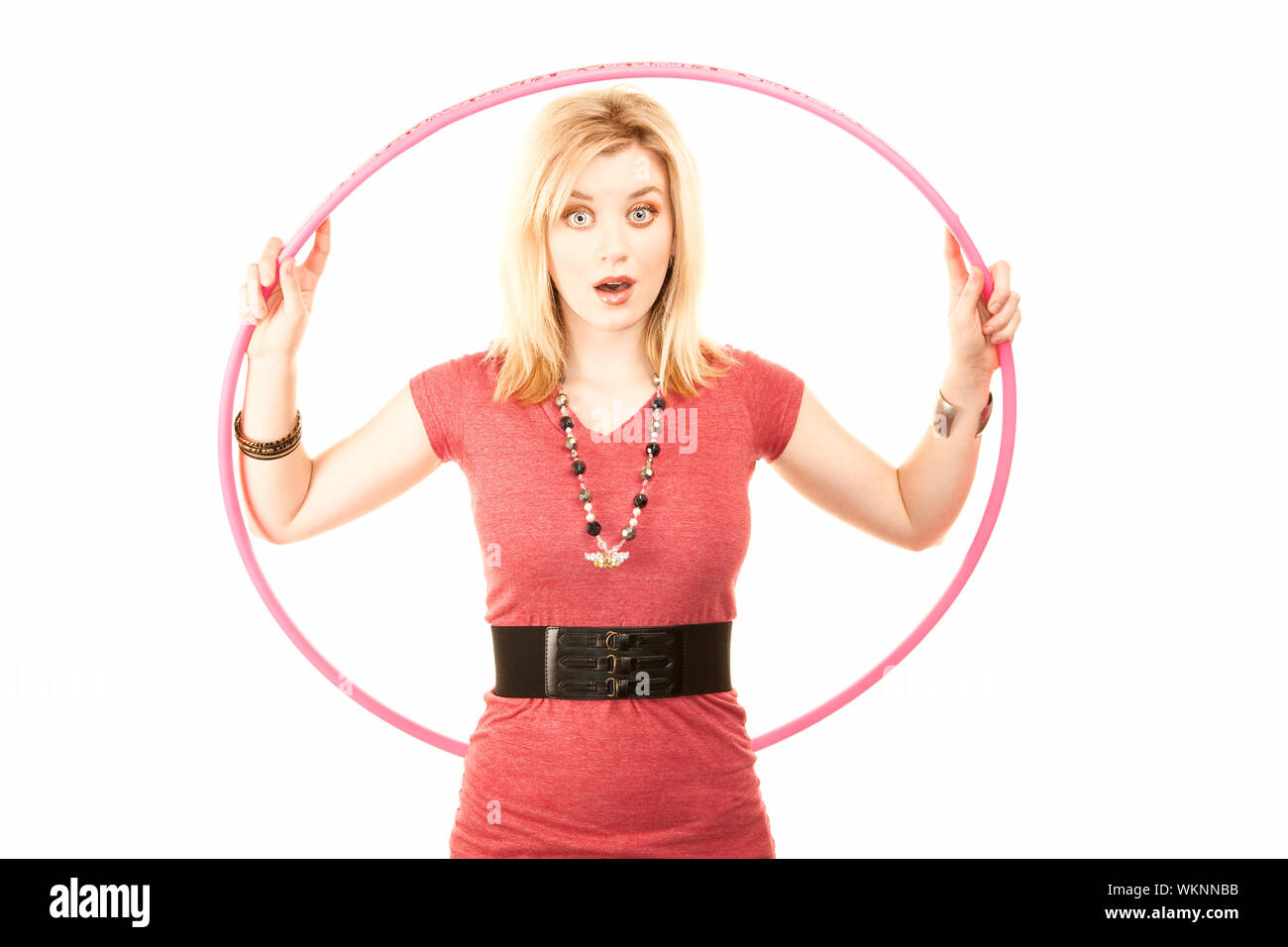Pretty young woman in casual clothes with plastic hoop Stock Photo - Alamy