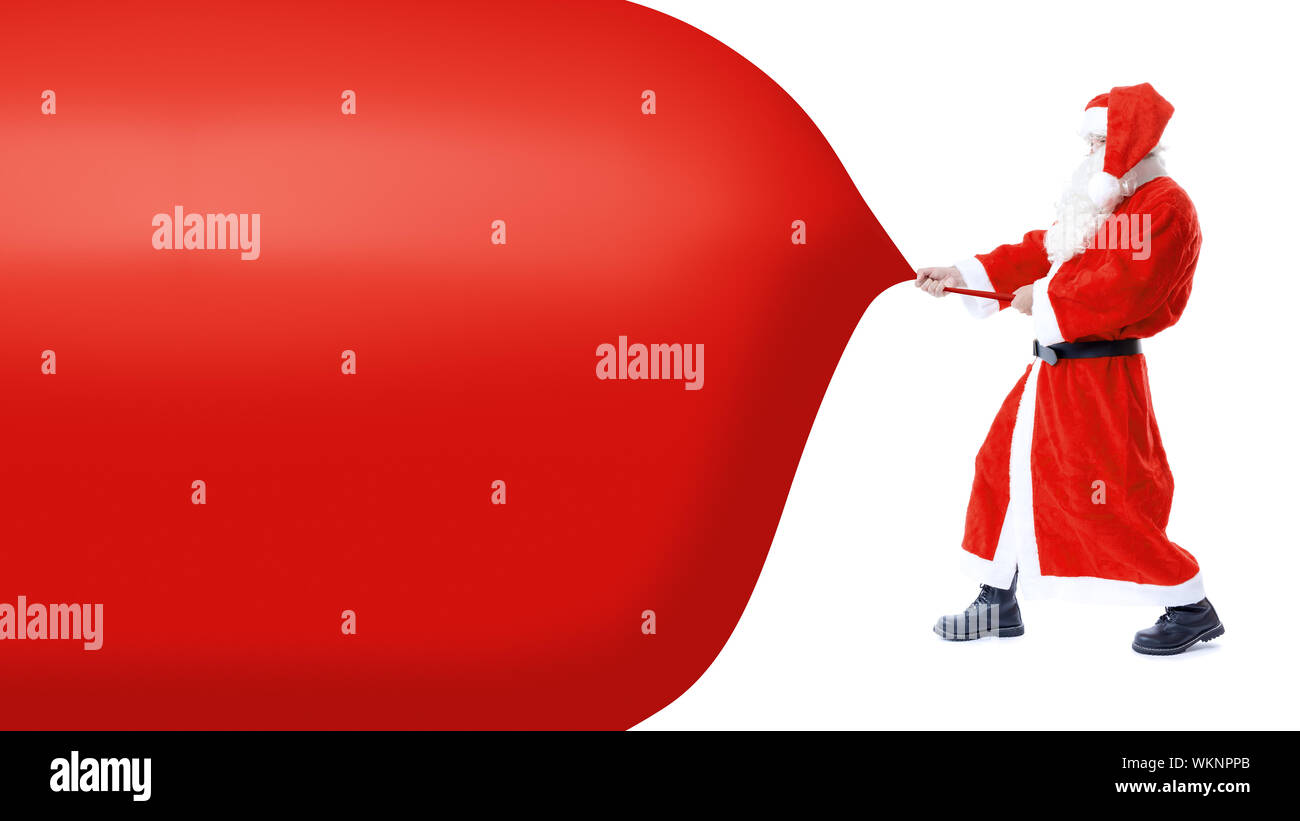 An image of Santa Claus is pulling something Stock Photo - Alamy
