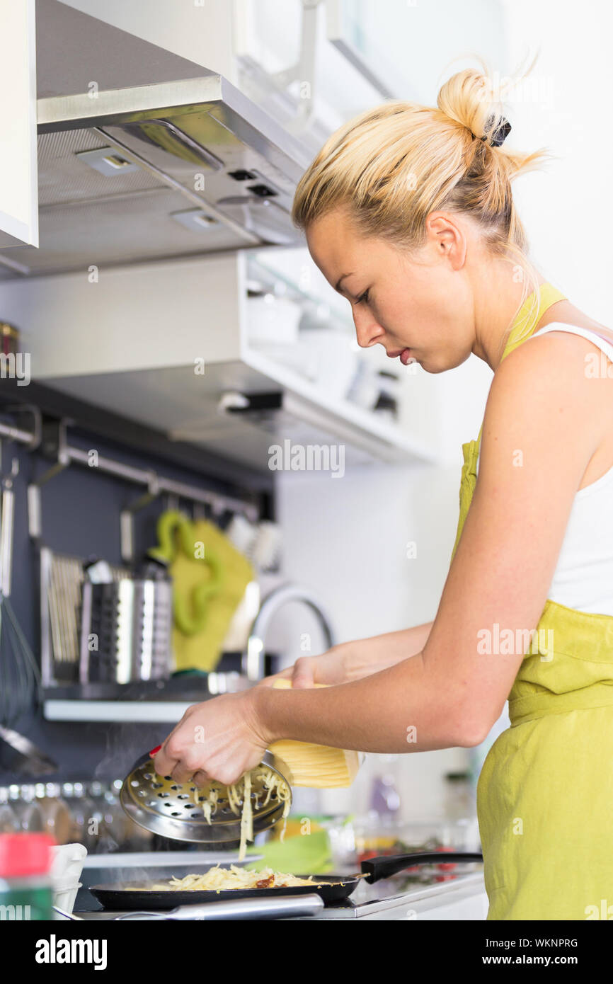 Young Mother Cooking at Home Stock Photo - Alamy