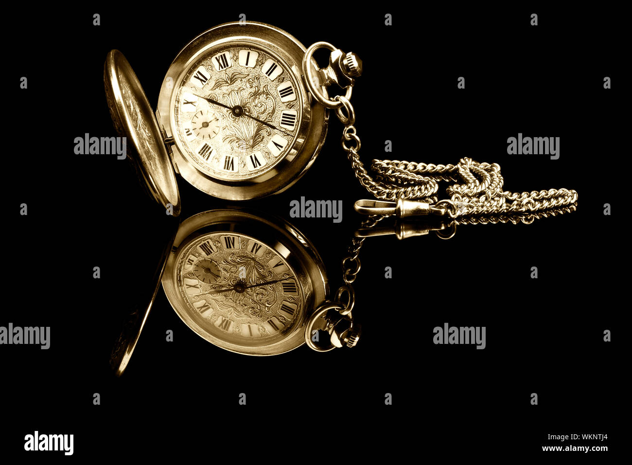 old pocket watch on black background with reflection Stock Photo - Alamy