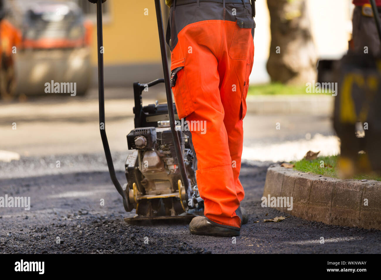 Asphalt surfacing manual labor Stock Photo - Alamy