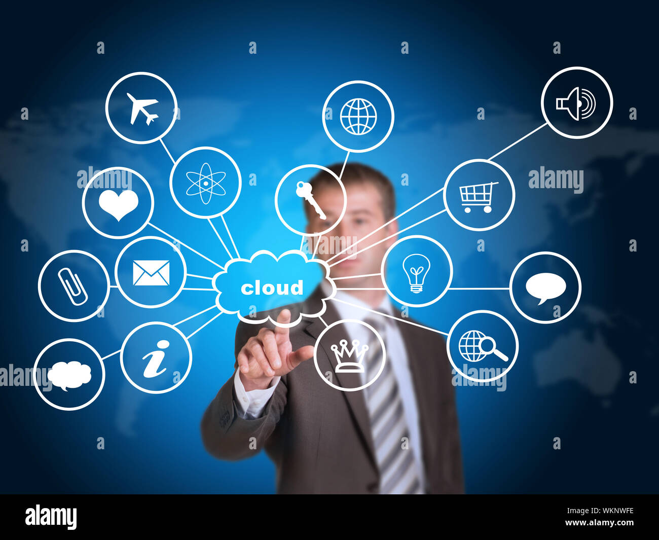 Business man pointing her finger at cloud with computer icons ...