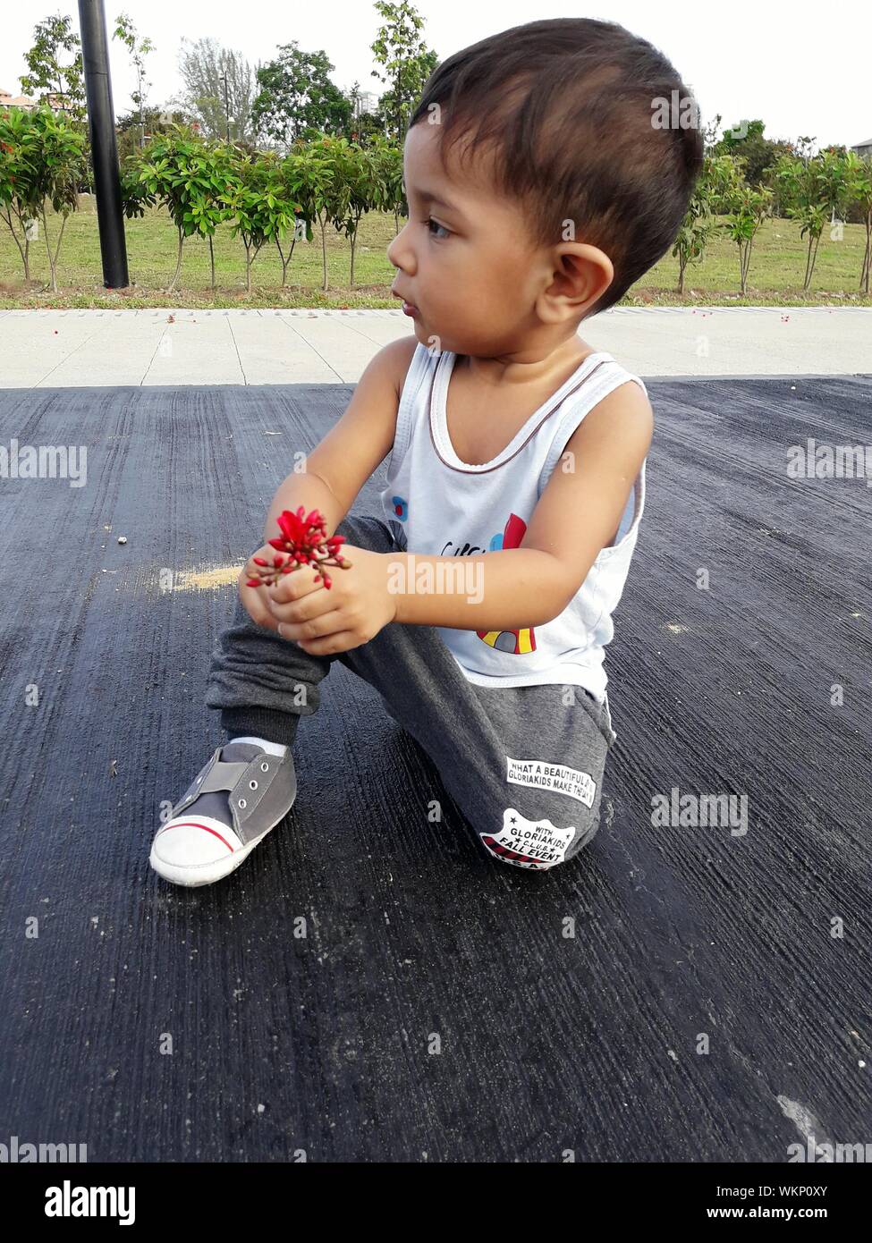 Kneeling boy hi-res stock photography and images - Alamy