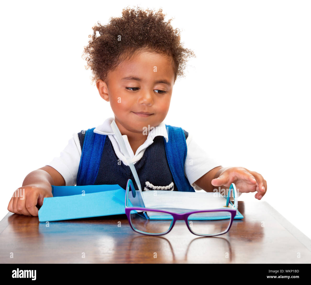 Little boy reading books Stock Photo - Alamy