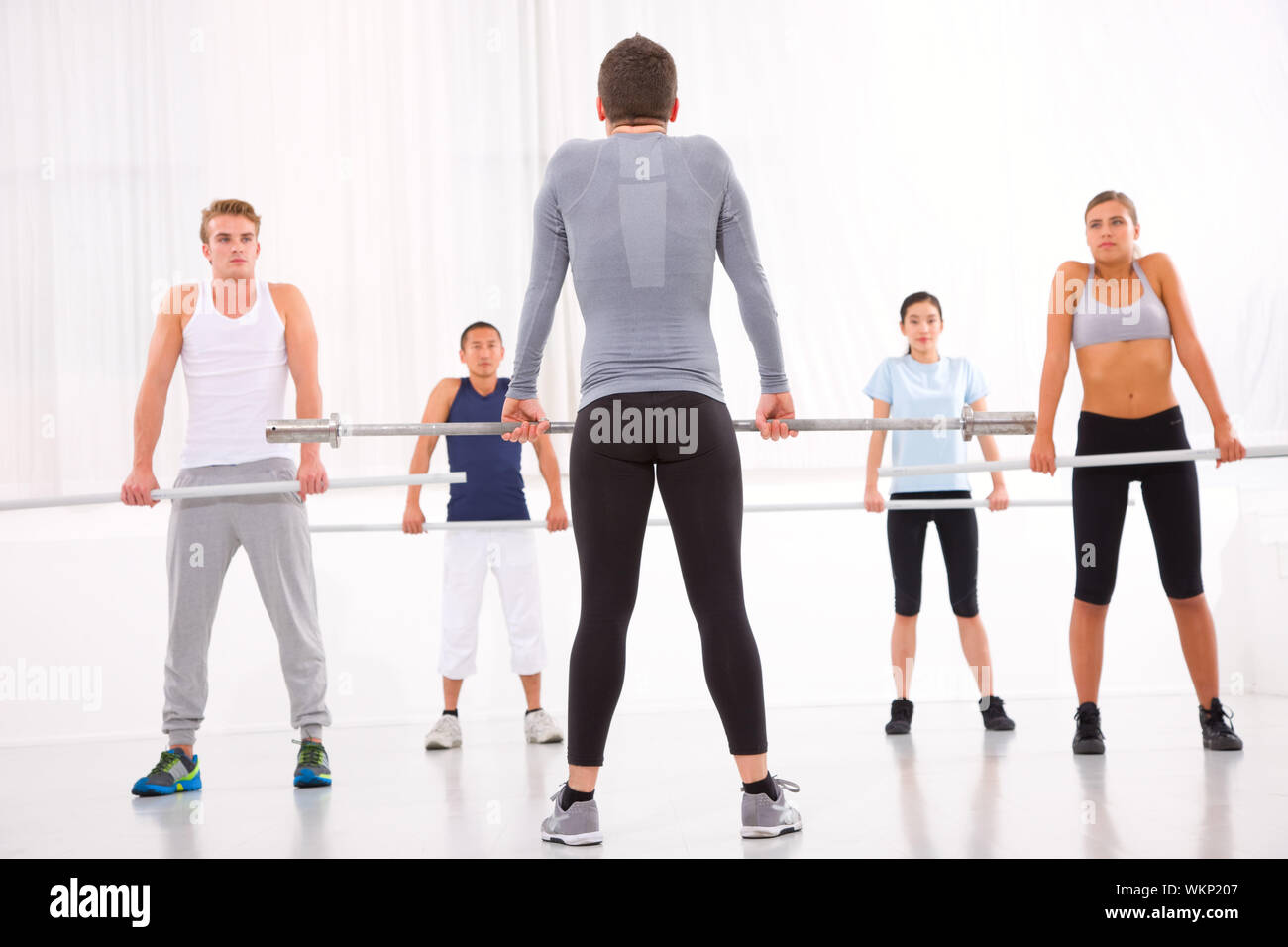Diverse group of people exercising in gym Stock Photo - Alamy