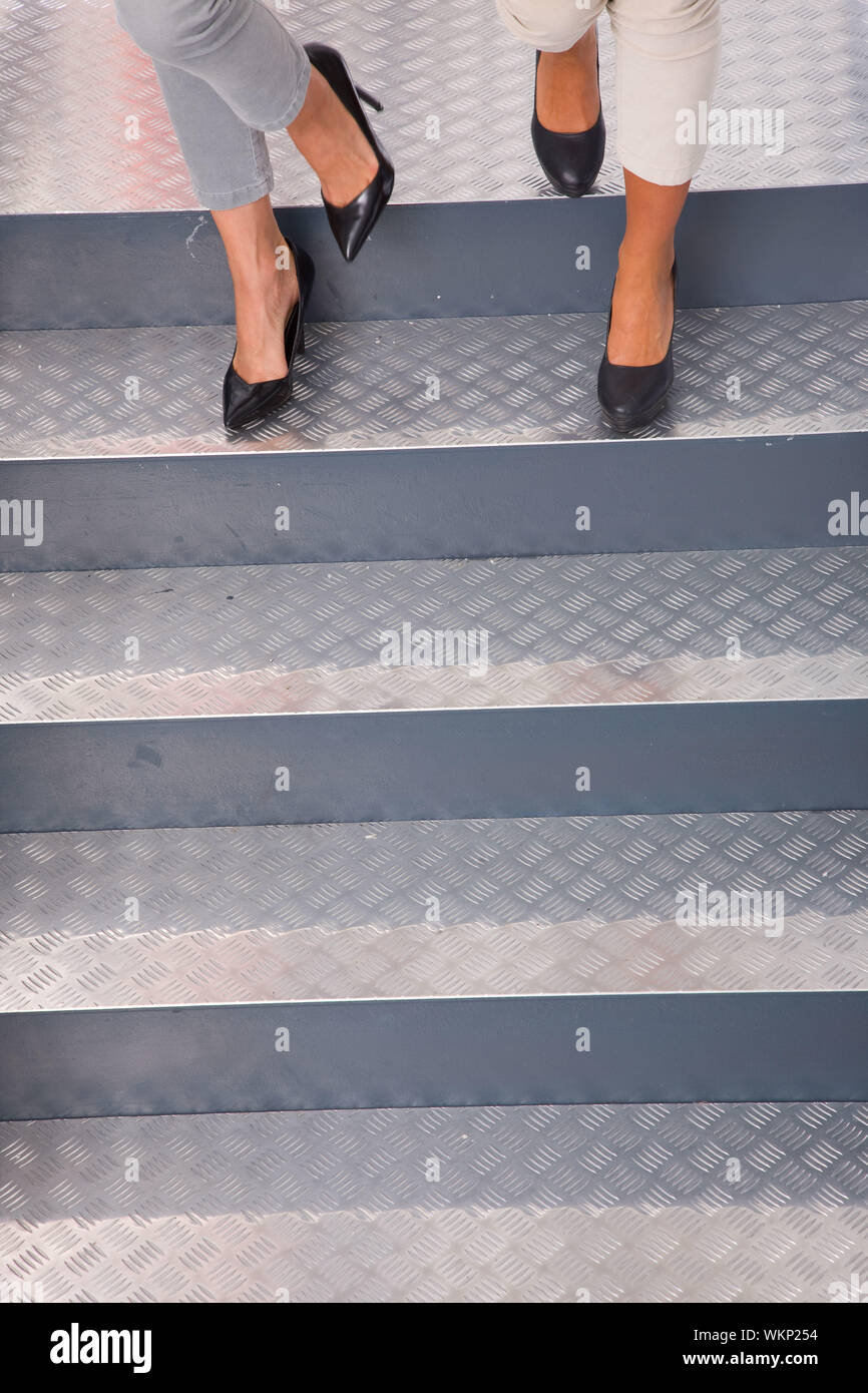 Close-up of two women's feet moving steps Stock Photo - Alamy