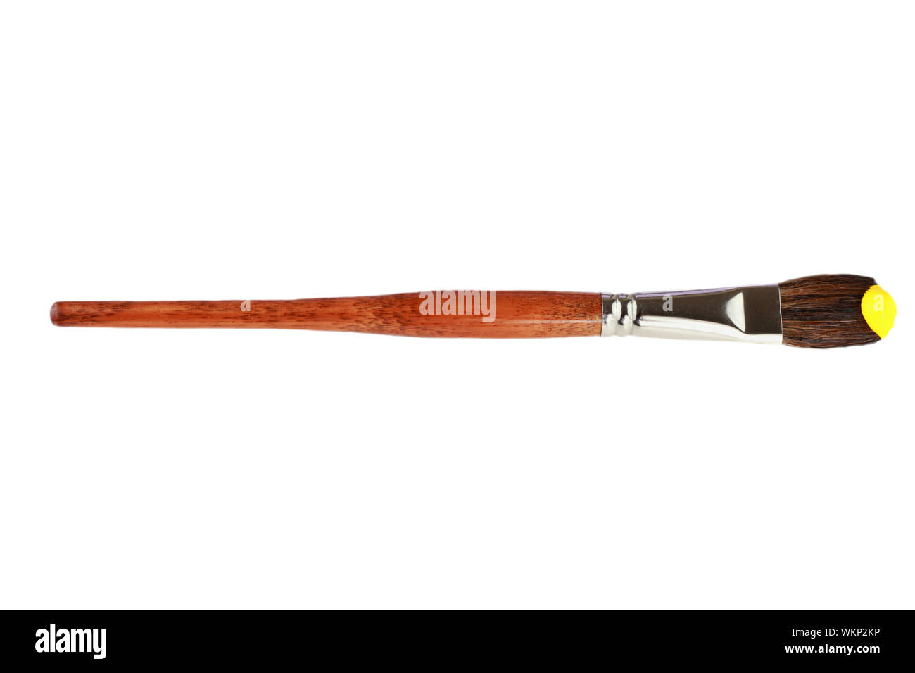 Wooden paintbrush with yellow acrylic paint on tip isolated on a white ...