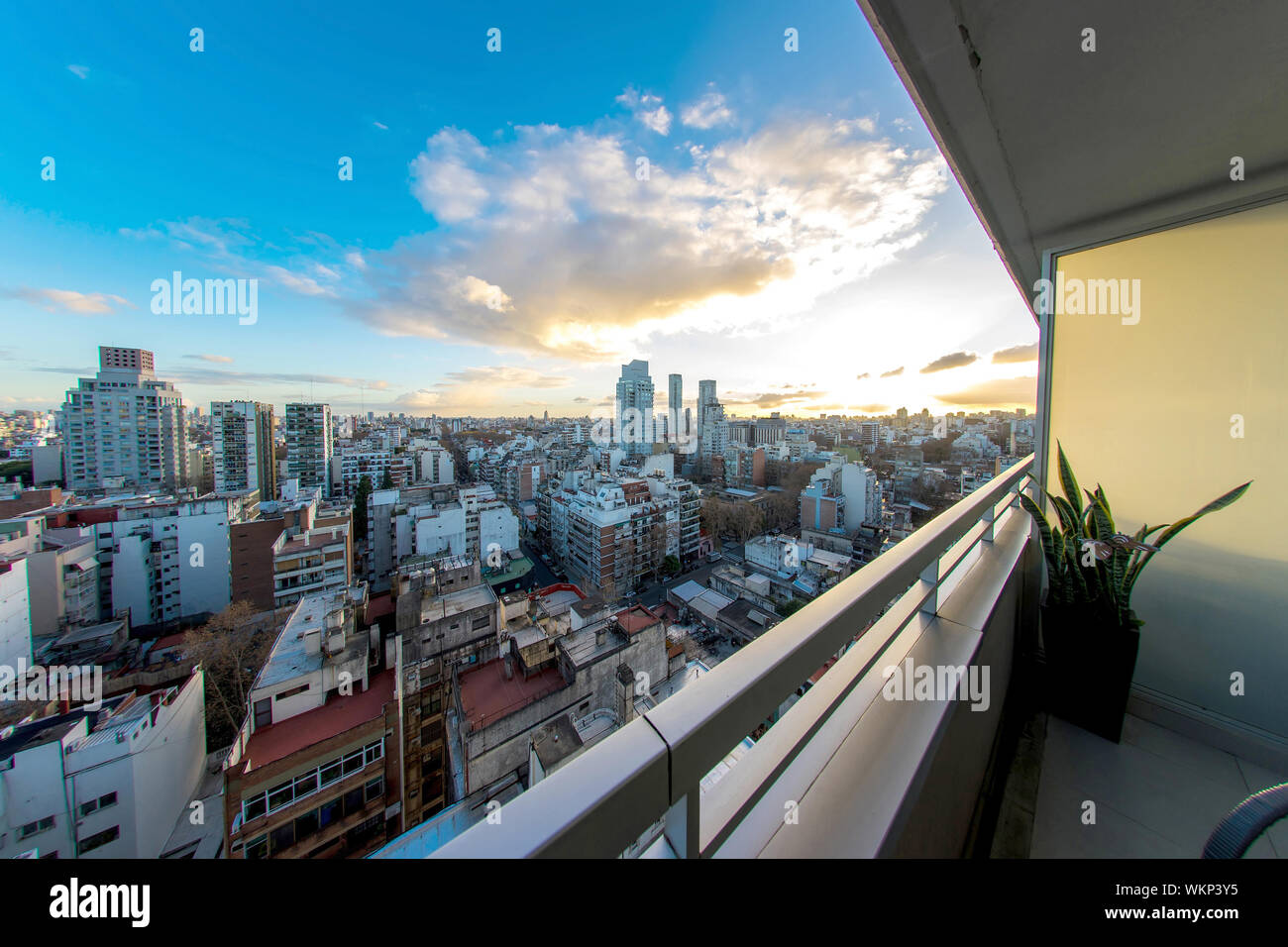 View on the skyline of the city from a balcony of a high rise apartment ...