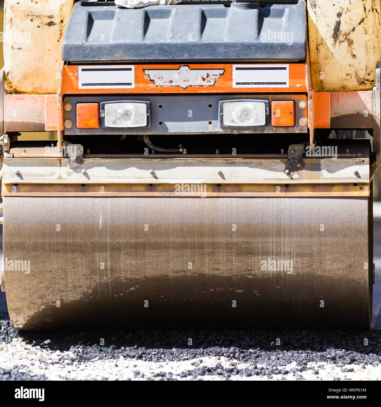 Asphalt surfacing manual labor Stock Photo - Alamy