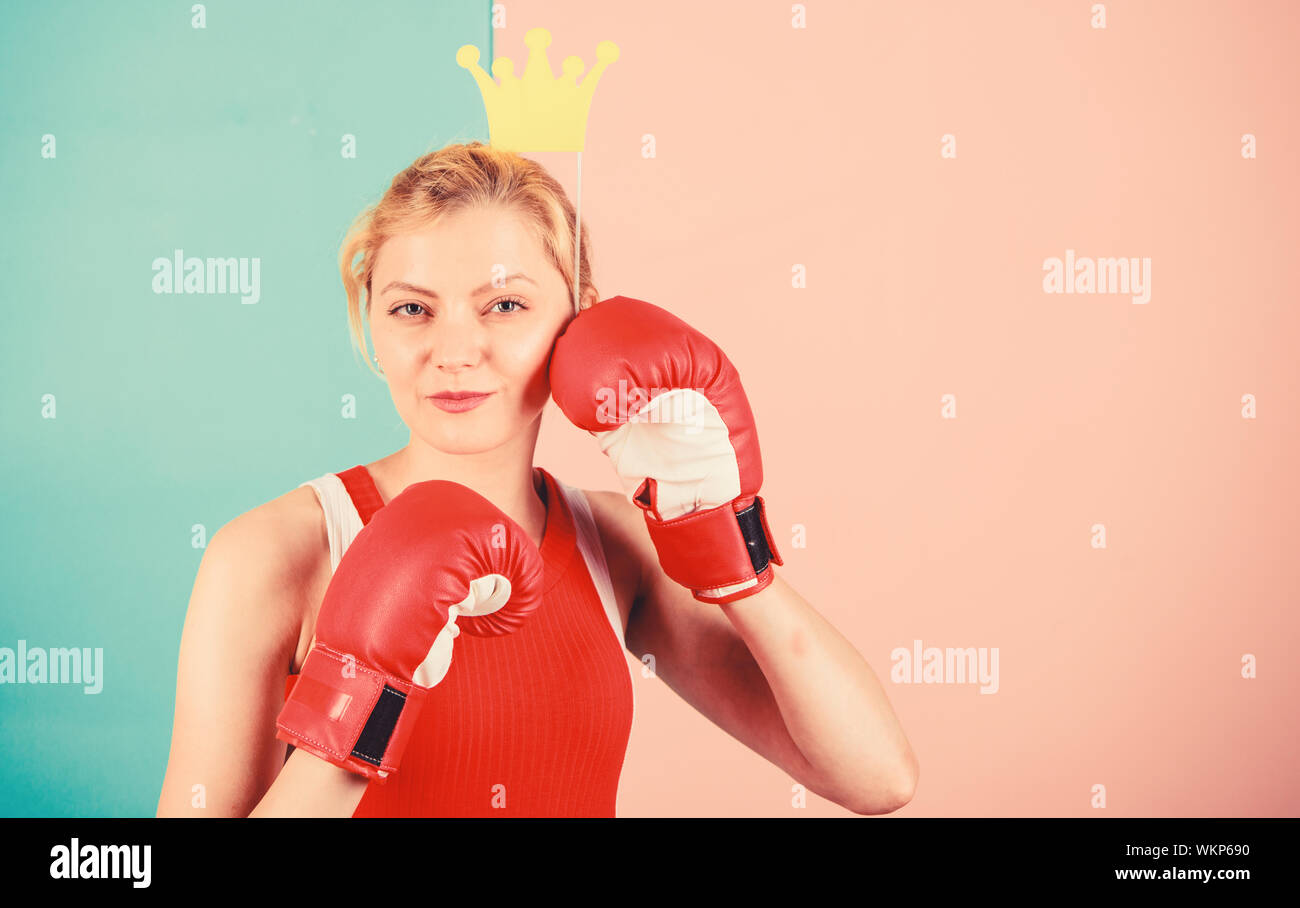 Feminine tender blonde with queen crown wear boxing gloves. Fight for ...