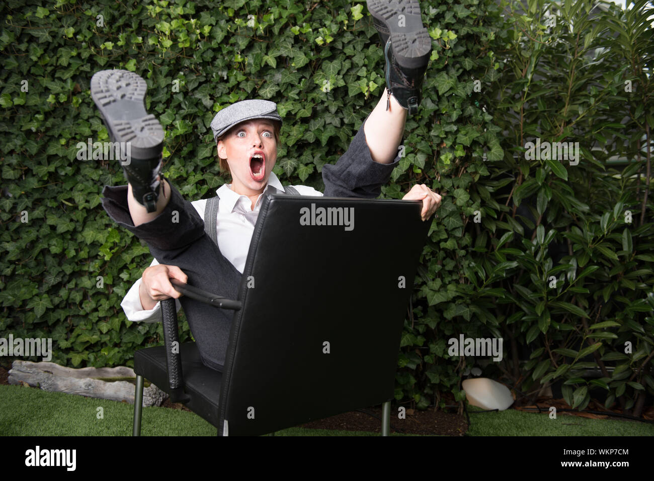 Woman falling chair hi-res stock photography and images - Alamy