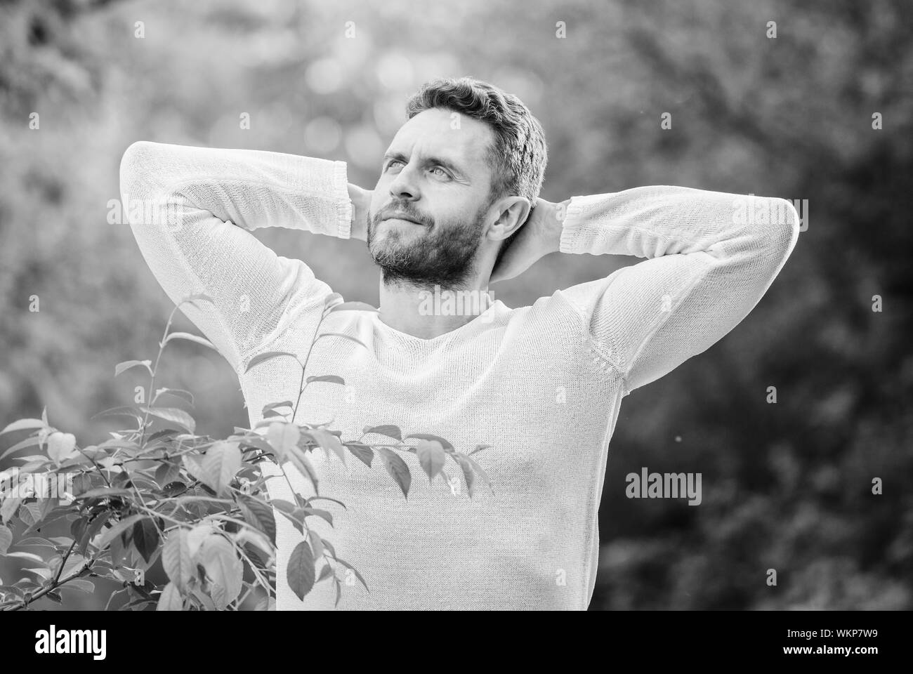 Feel power of nature. Man handsome bearded guy morning stretching ...