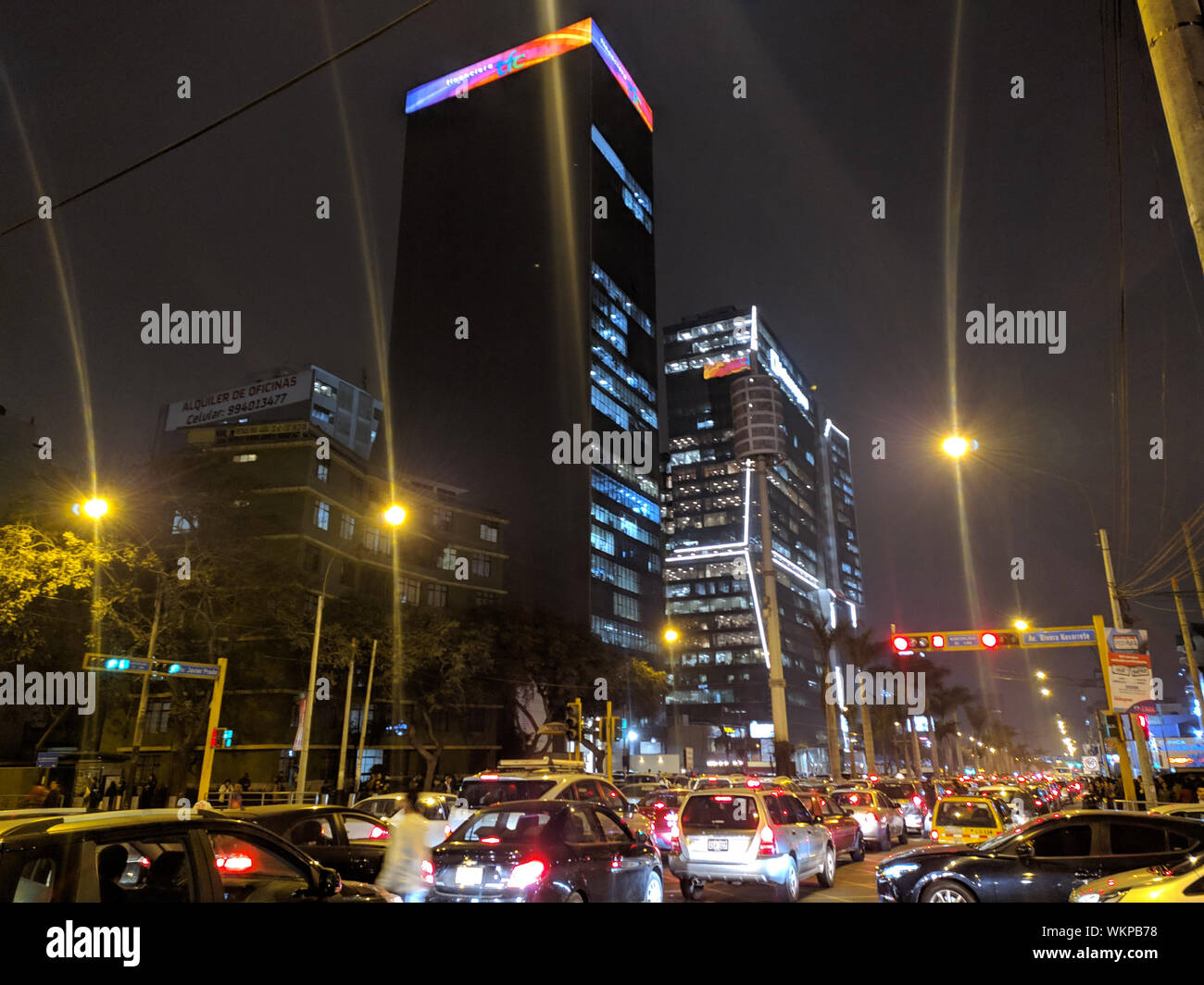 San isidro district in Lima Peru with a lot of traffic by night on the ...