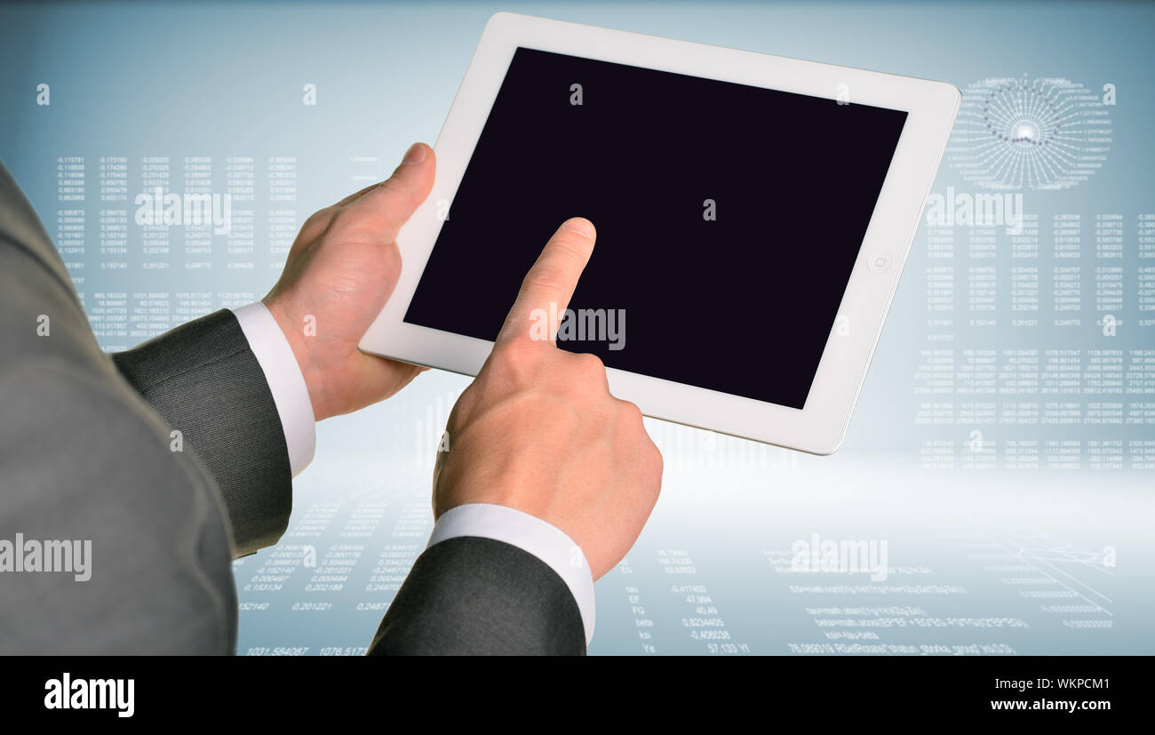 Two hands using tablet pc on hi-tech background Stock Photo - Alamy