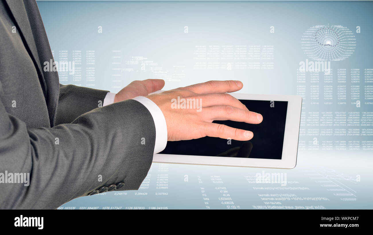 Two hands using tablet pc on hi-tech background Stock Photo - Alamy