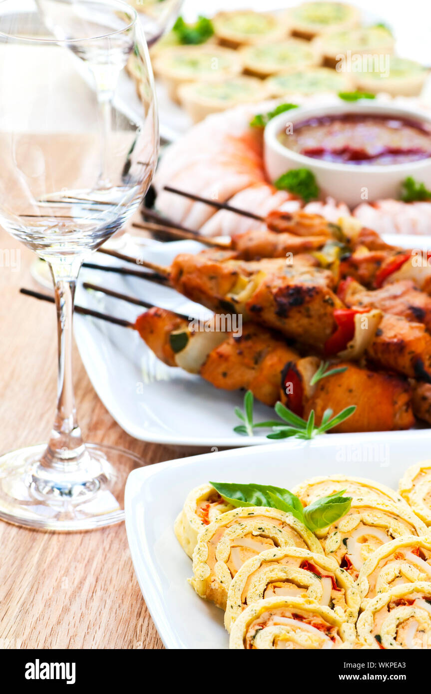 Many dishes of bite size appetizers and party food Stock Photo - Alamy
