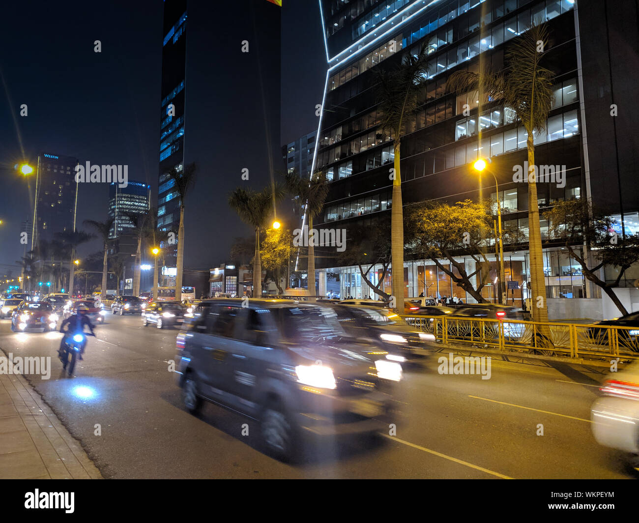 San isidro district in Lima Peru with a lot of traffic by night on the ...