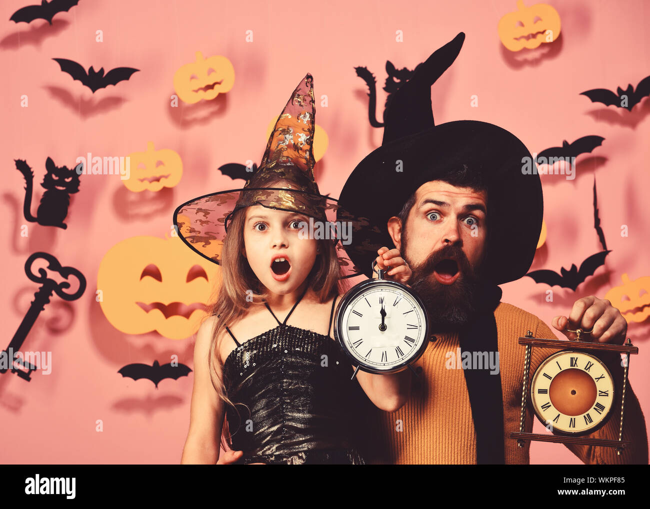 Halloween party and celebration concept. Father and daughter in ...