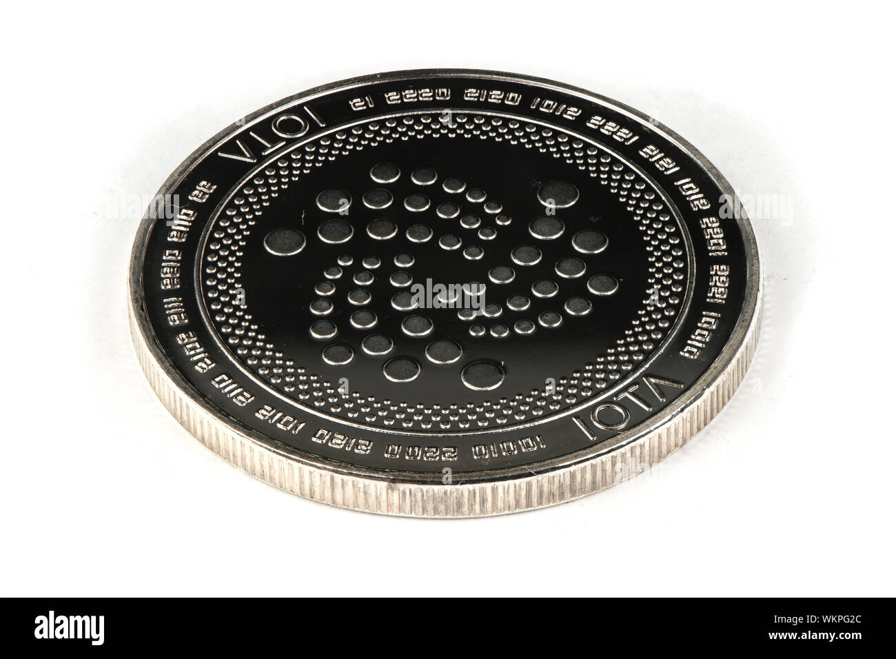 Face of the crypto currency silver iota isolated on white background ...