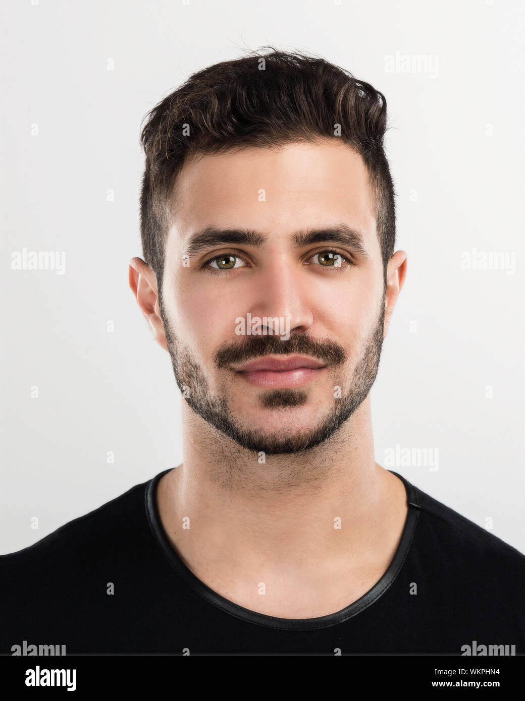 Studio portrait of a handsome young man Stock Photo - Alamy