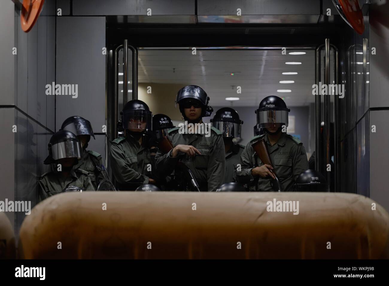 Hong Kong, CHINA. 4th Sep, 2019. Riot Policemen stand guard on the ...