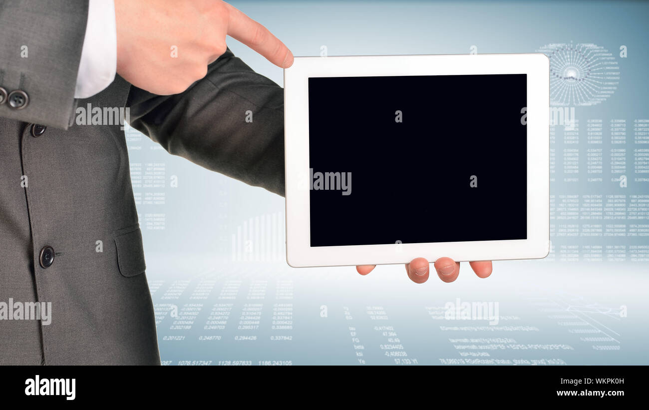 Two hands using tablet pc on hi-tech background Stock Photo - Alamy