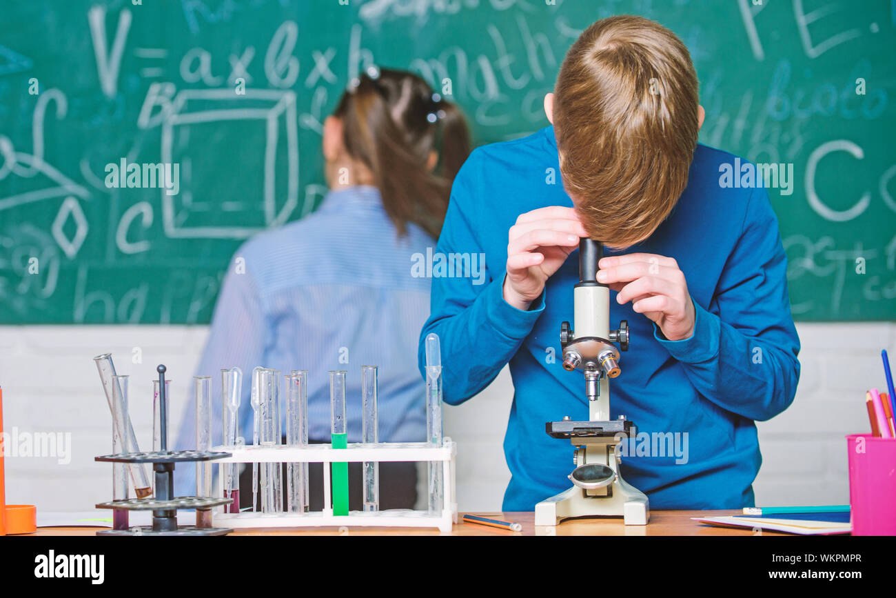 Hard to diagnose. students doing biology experiments with microscope ...