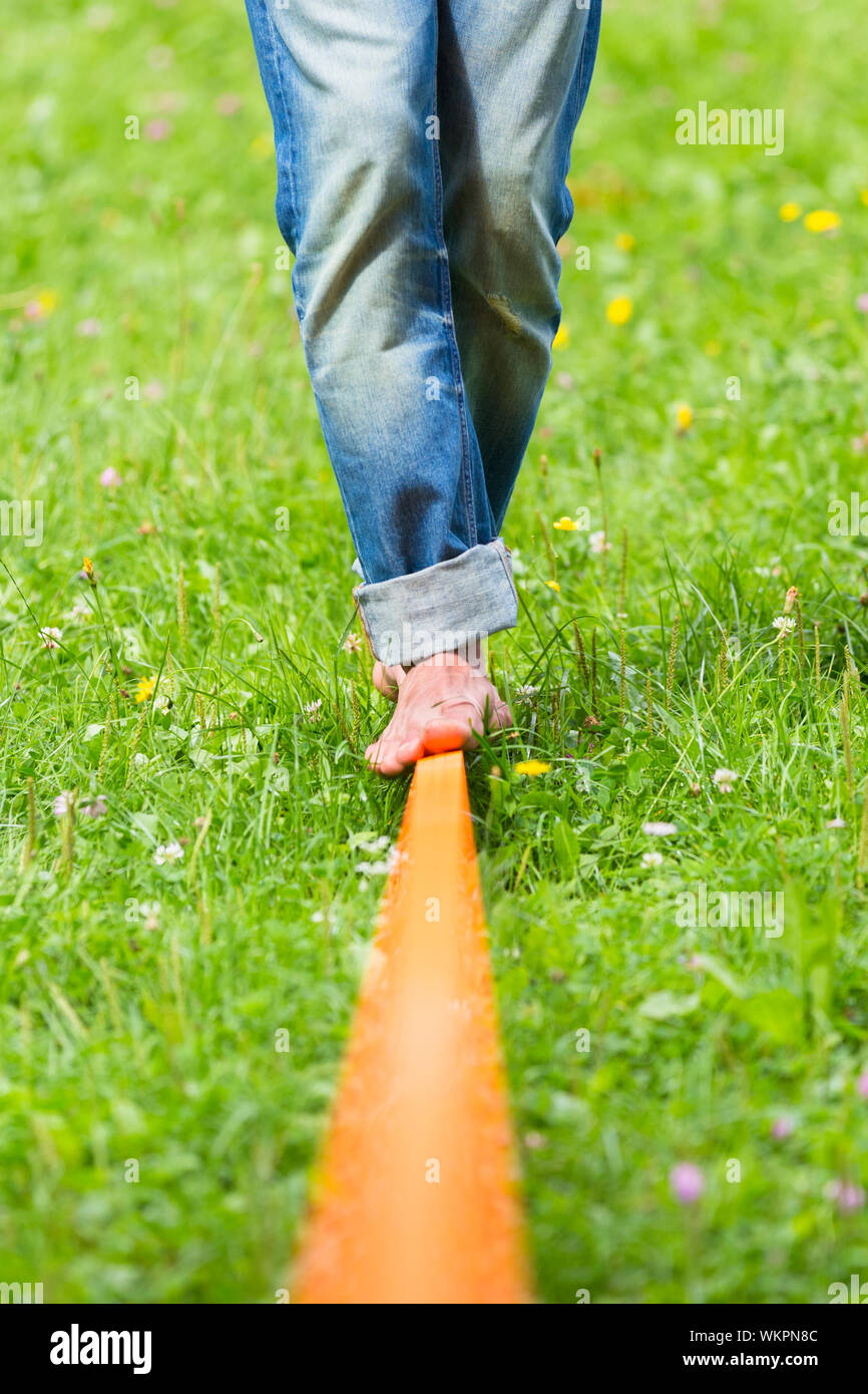 Slack line in the city park Stock Photo - Alamy