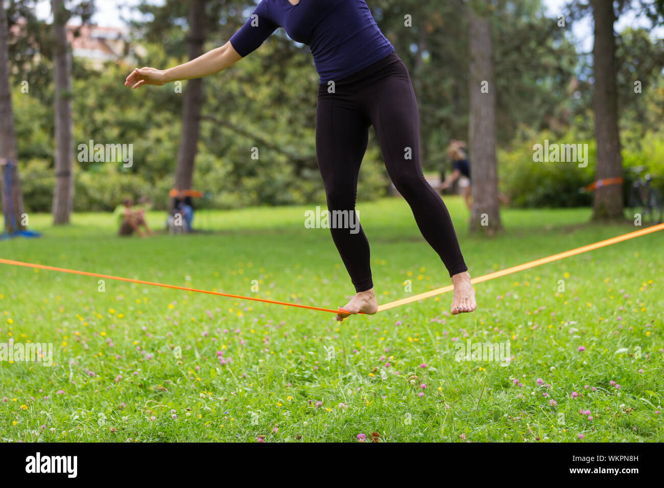 Slack line in the city park Stock Photo - Alamy