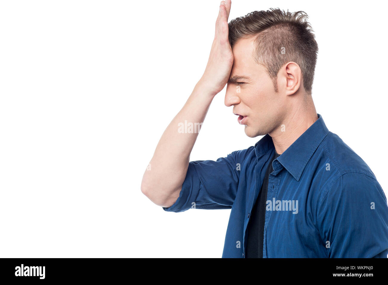 Upset man holding his forehead on hand Stock Photo - Alamy