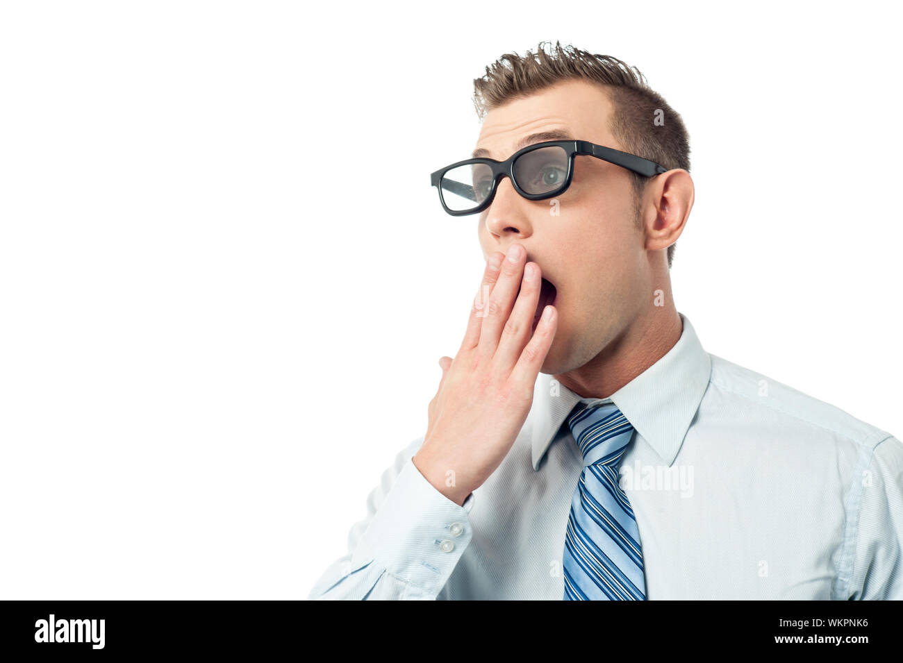 Astonished young business executive looking up Stock Photo - Alamy