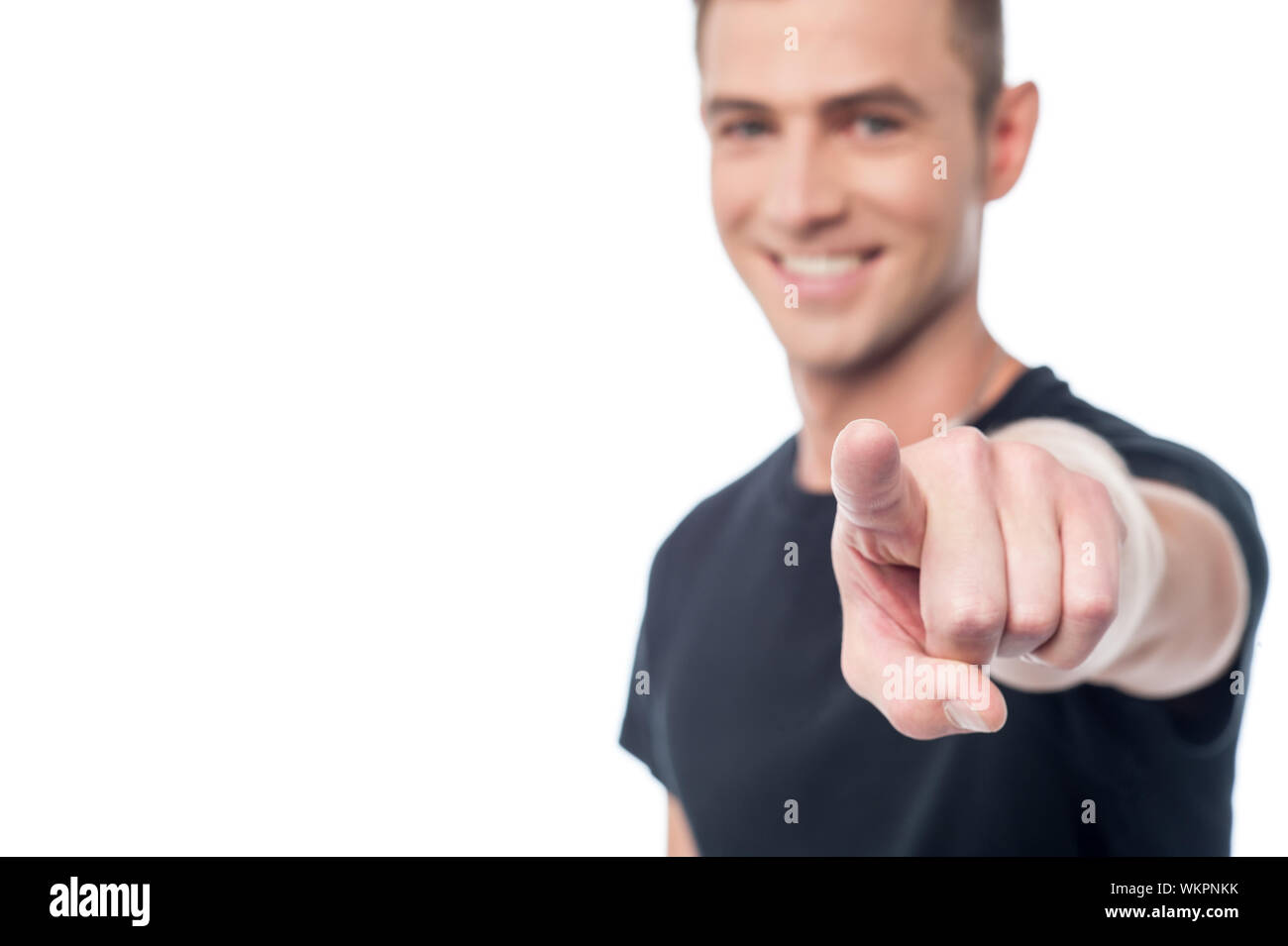 Handsome young man pointing towards camera Stock Photo - Alamy