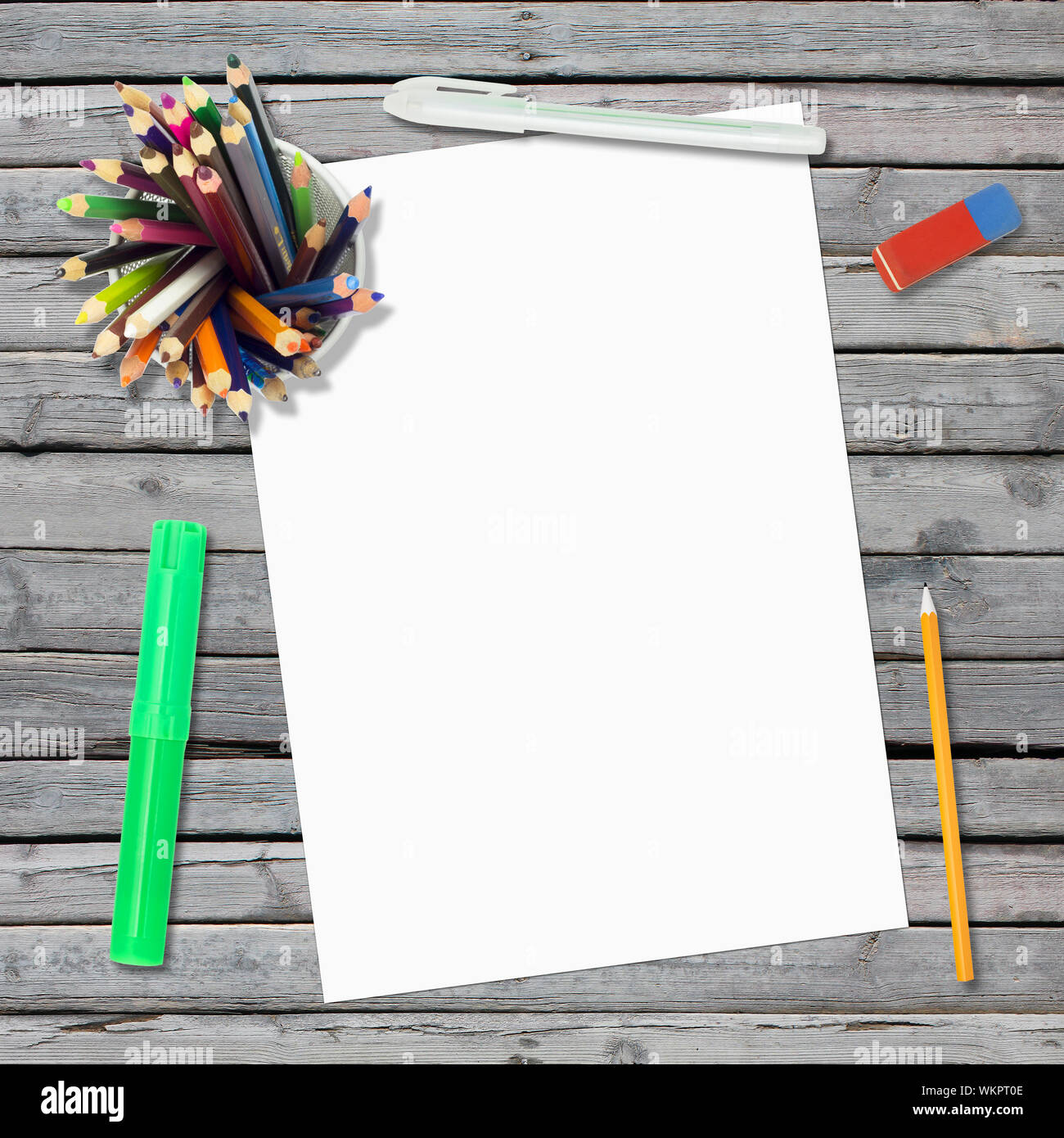 Lie on wooden floor empty paper sheet and stationery. Education concept ...