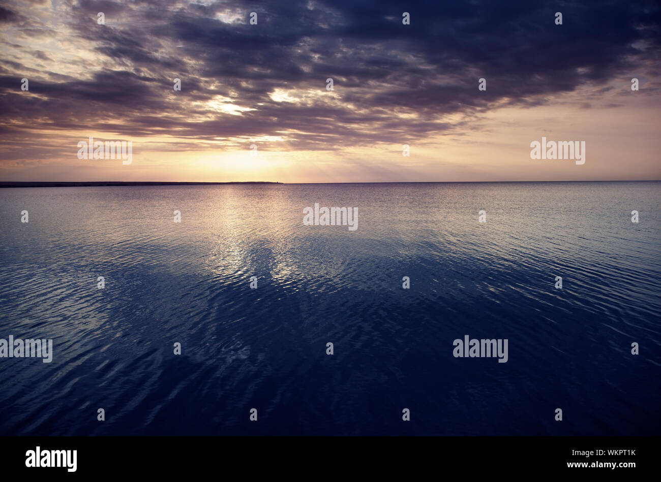 Sunset at the sea. Horizontal photo with natural light and darkness ...