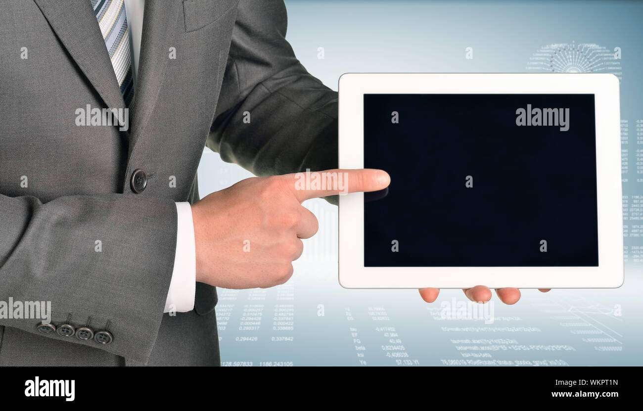 Two hands using tablet pc on hi-tech background Stock Photo - Alamy