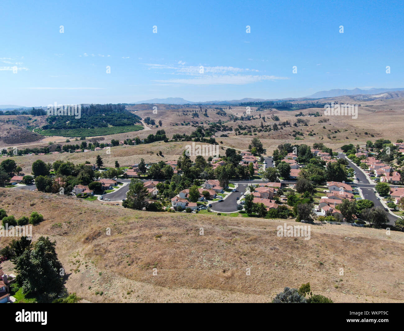 Aerial view of small neighborhood with dry desert mountain on the ...