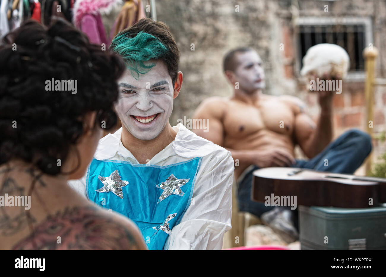 Giggling male cirque clown laughing with friend backstage Stock Photo ...