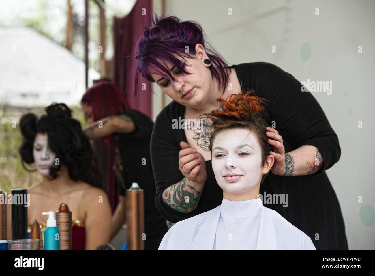 Stylist tattoo fixing hair hi-res stock photography and images - Alamy