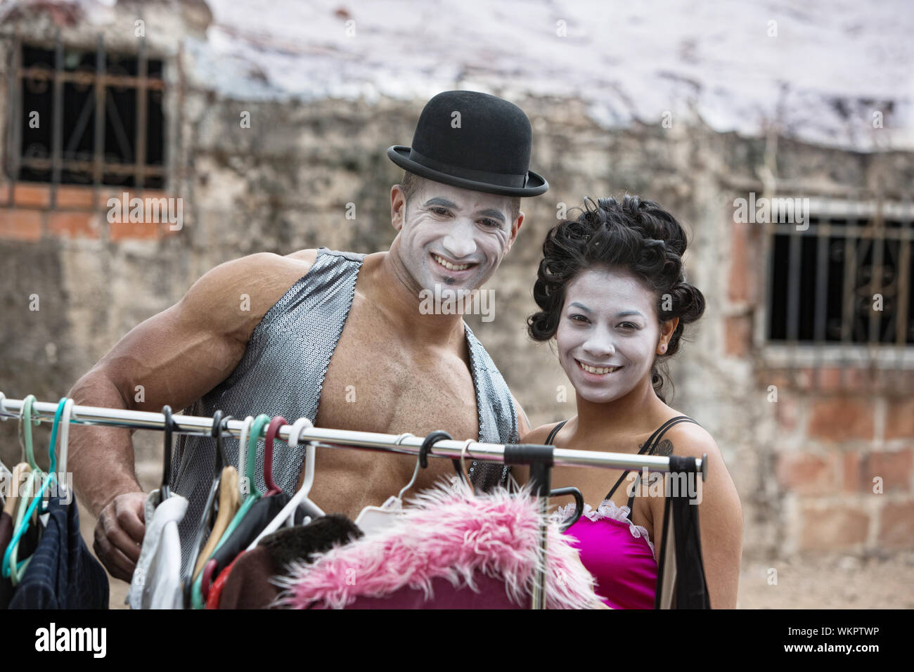 Handsome clown with muscles and hat with partner Stock Photo - Alamy