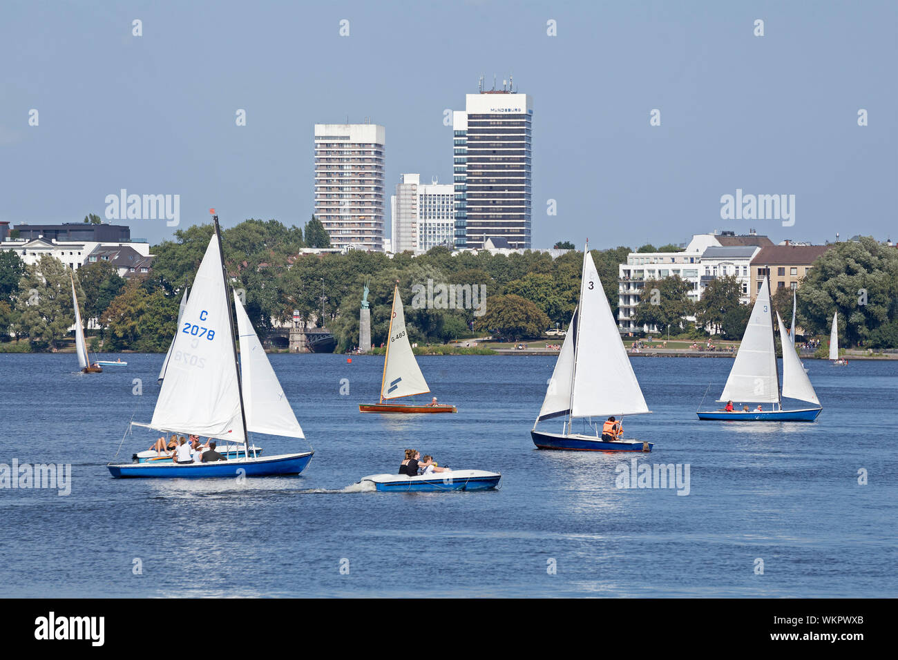 Mundsburg tower buildings, sailing boats on Lake Outer Alster, Hamburg ...