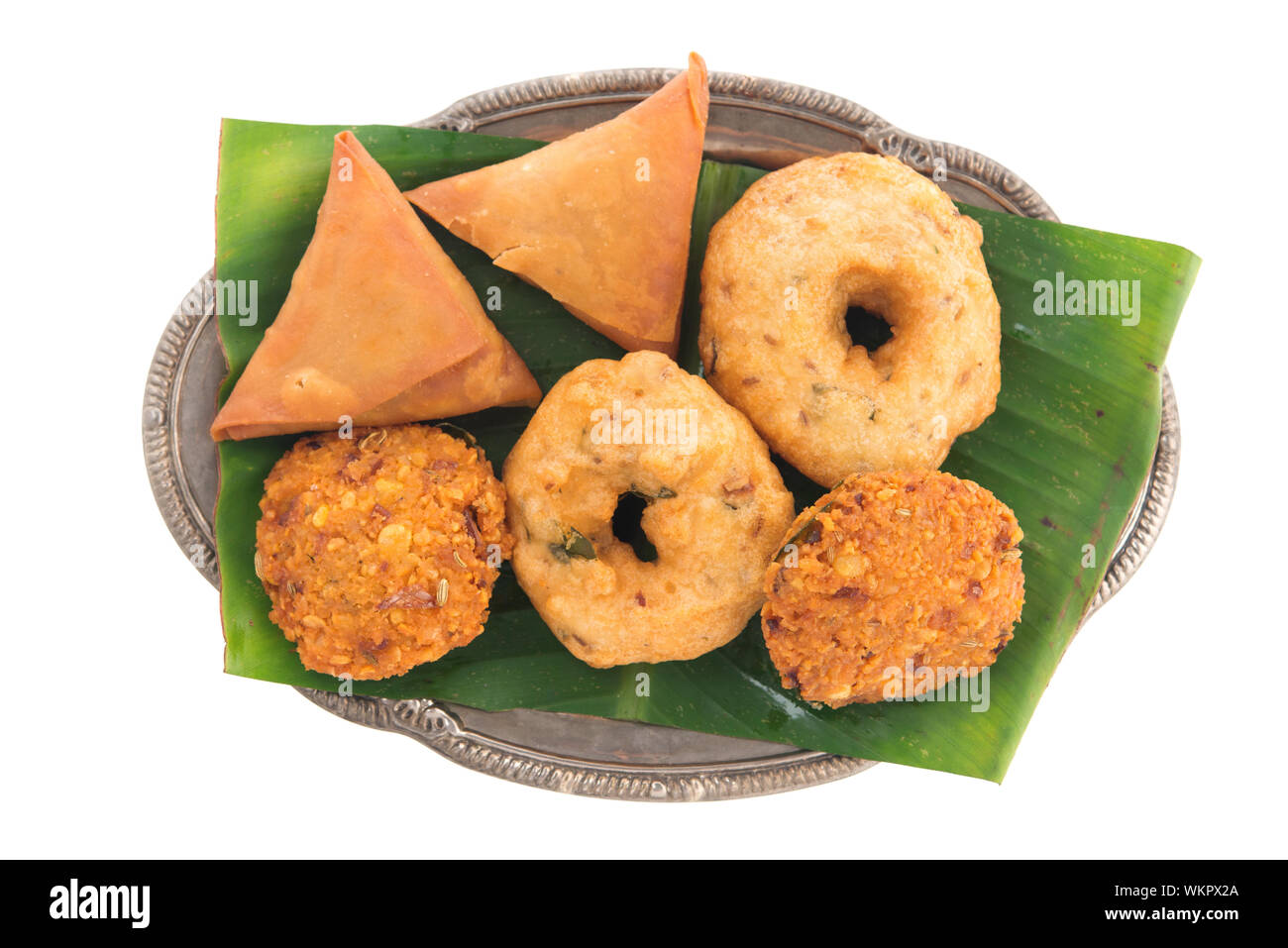 Delicious traditional Indian snack platter isolated on white background ...