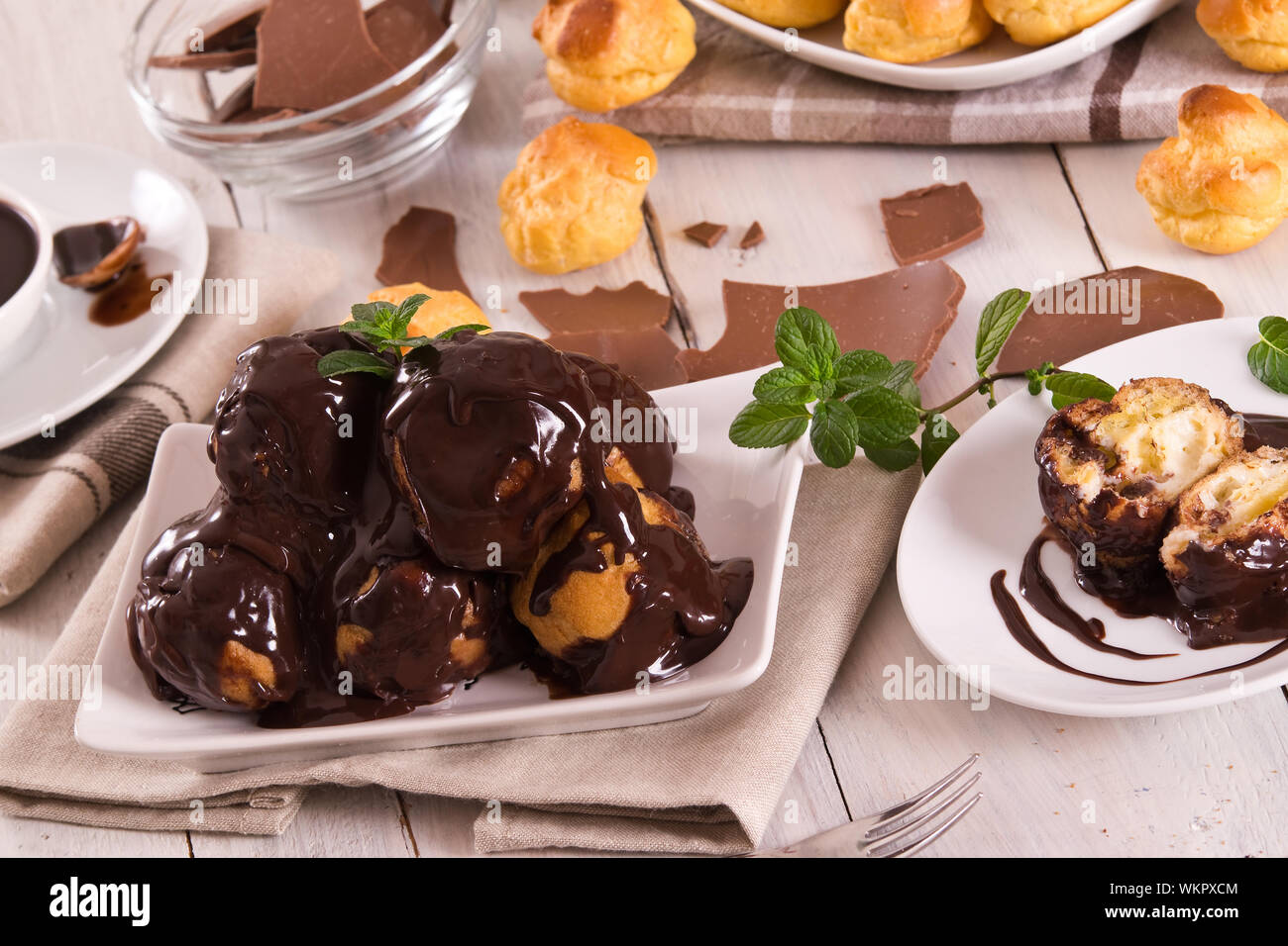Chocolate profiteroles with chantilly cream hi-res stock photography ...
