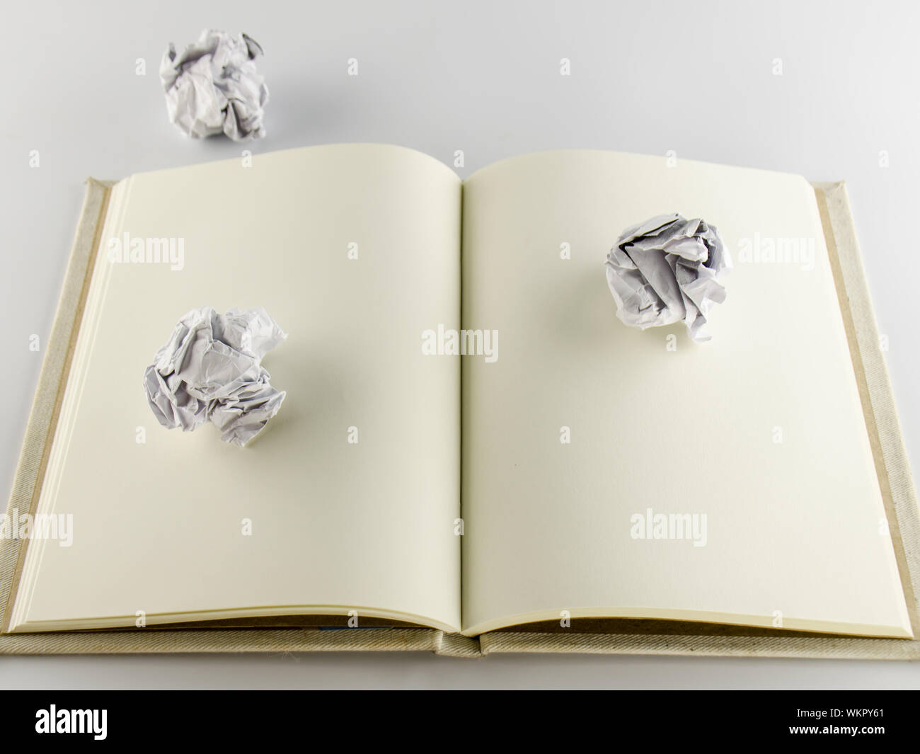 crumpled paper and notebook on a white background Stock Photo - Alamy