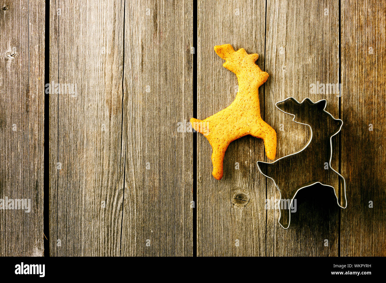Christmas homemade gingerbread deer over wooden table Stock Photo - Alamy