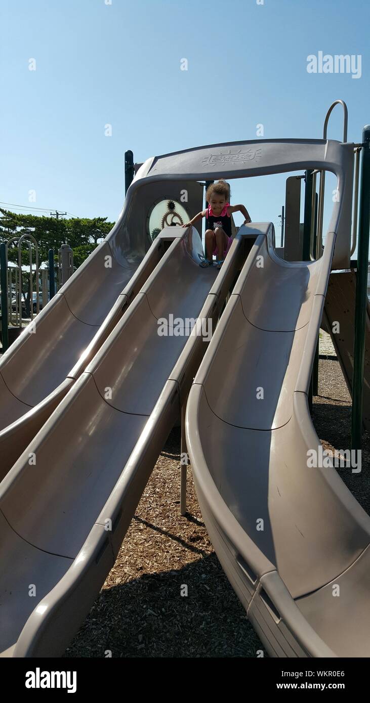 Girls play on slides hi-res stock photography and images - Alamy