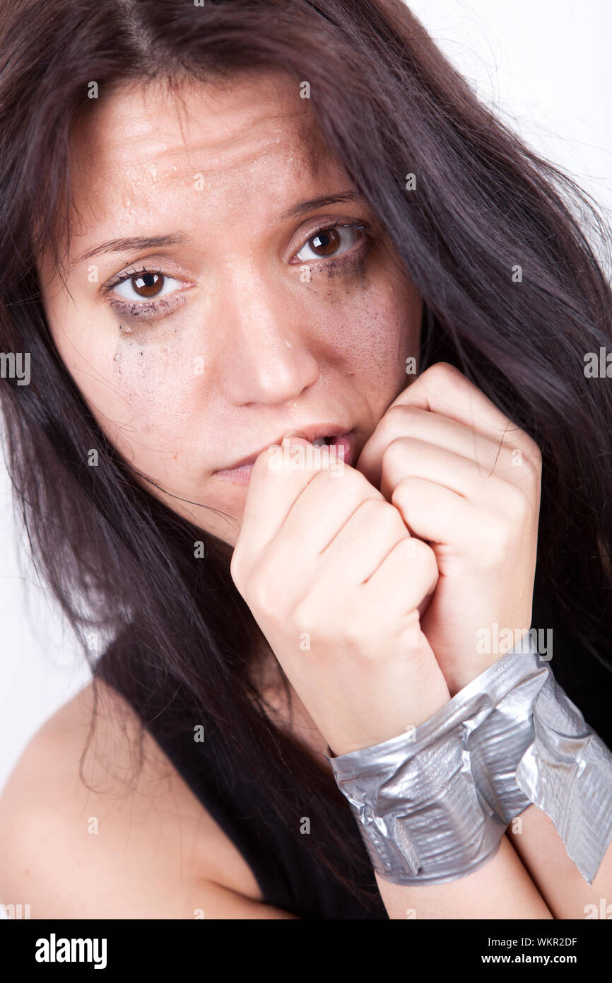 kidnapped young woman, hostage closeup on white background Stock Photo ...