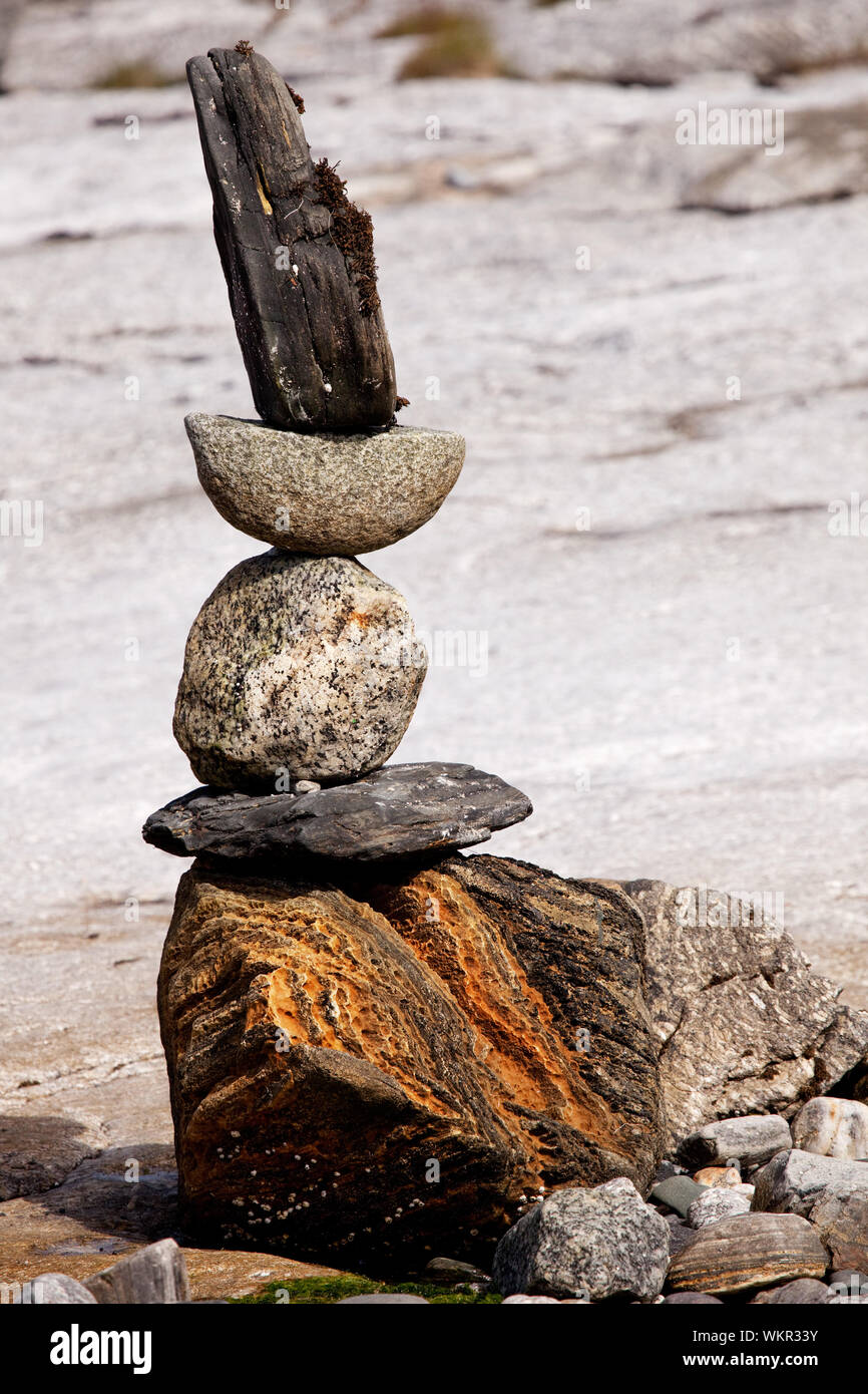 A rock stacking sculpture statue on a Norwegian landscape Stock Photo ...