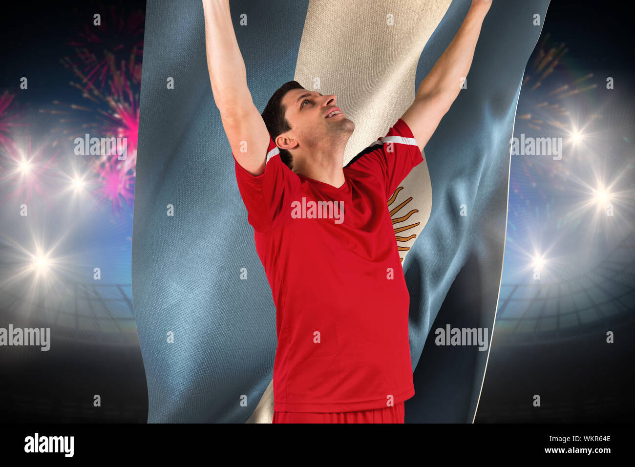 Excited football player cheering against fireworks exploding over ...